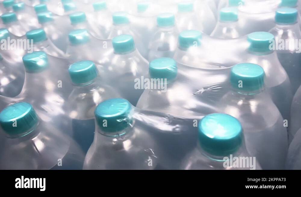 Two-liter bottles of mineral water packed in 6 bottles stand in ...