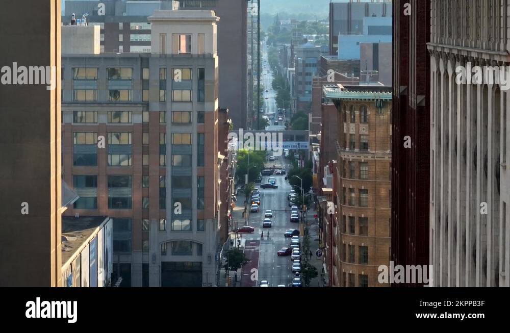 Tight long aerial of skyscraper tower buildings in golden hour light ...