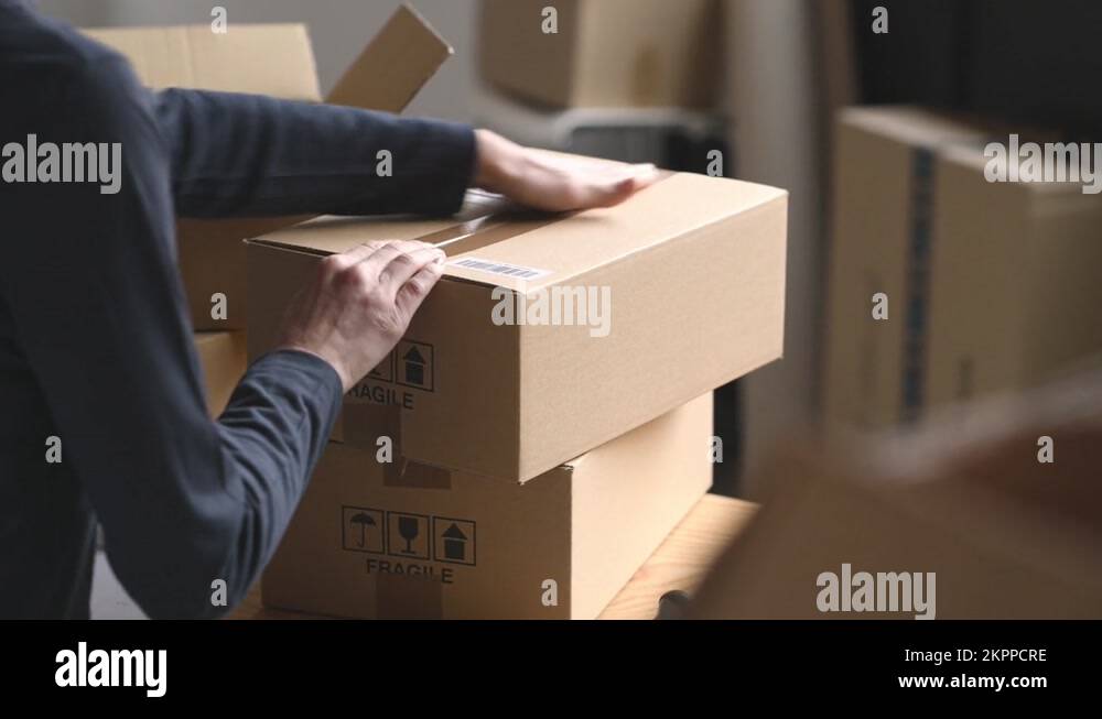 Scanning parcel barcode before shipment Stock Video Footage - Alamy