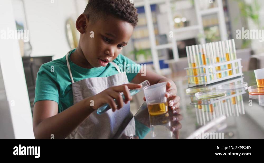 Video of african american boy doing experiments at home Stock Video ...