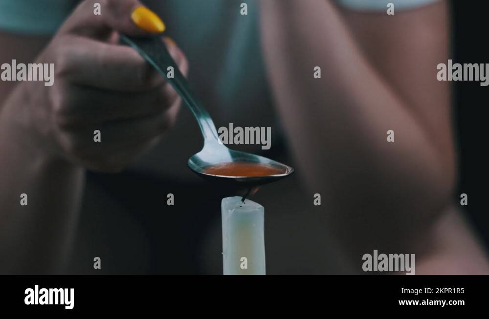 Woman Drug Addict Cooking Drugs in Spoon on Candle Flame Stock Video ...