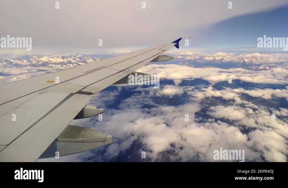 Process plate passenger pov of jet Airbus A320 airplane wing flying ...