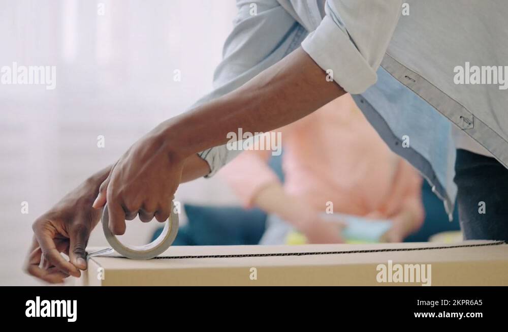 Young couple taping cardboard Stock Videos & Footage - HD and 4K Video ...