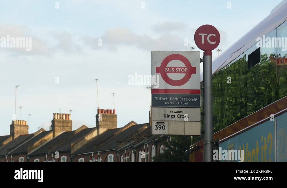 Bus leaving and bus stop sign at Tufnell Park station. London, England ...