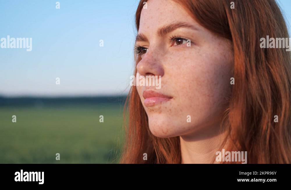 Beautiful female ginger face with freckles on nature at sunset Stock ...
