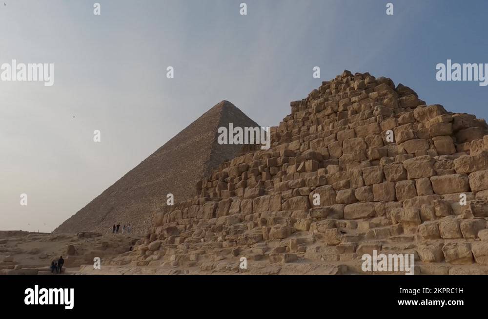 People in front of the Pyramid of Khufu, at the Giza pyramid complex ...