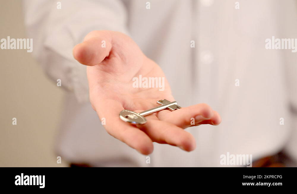 Hand holding keys Stock Videos & Footage - HD and 4K Video Clips - Alamy