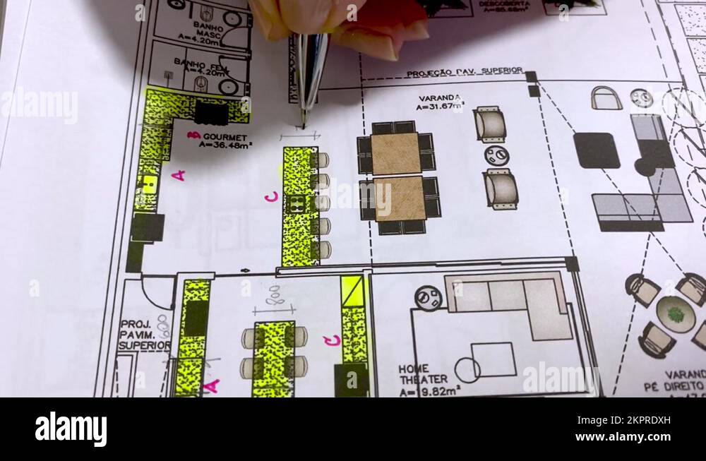 Architect making notes on the blueprints of a home design project Stock ...
