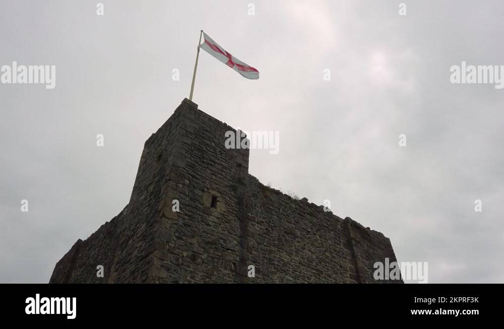 St George Cross flag waving on top of gothic castle turret silhouette ...