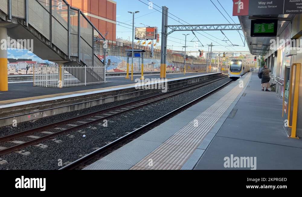 Incoming railway train arriving at milton train station, Queensland ...