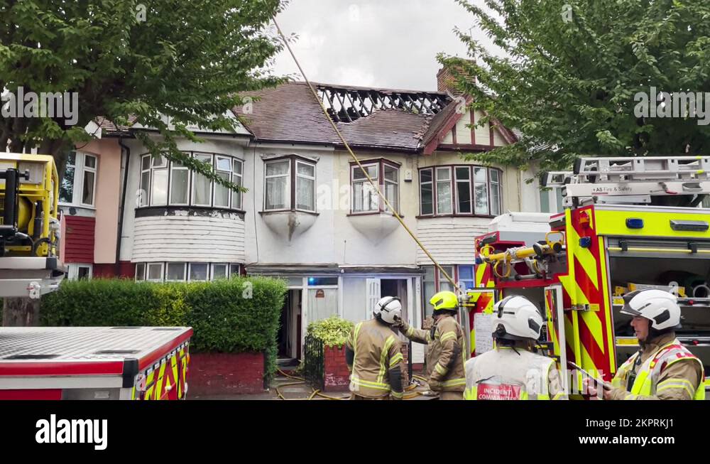 Officers of London Fire Brigade attend the scene of a house on a Stock ...