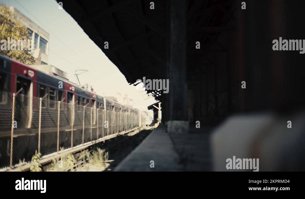 Old railway warehouse revealed by truck camera movement with train ...