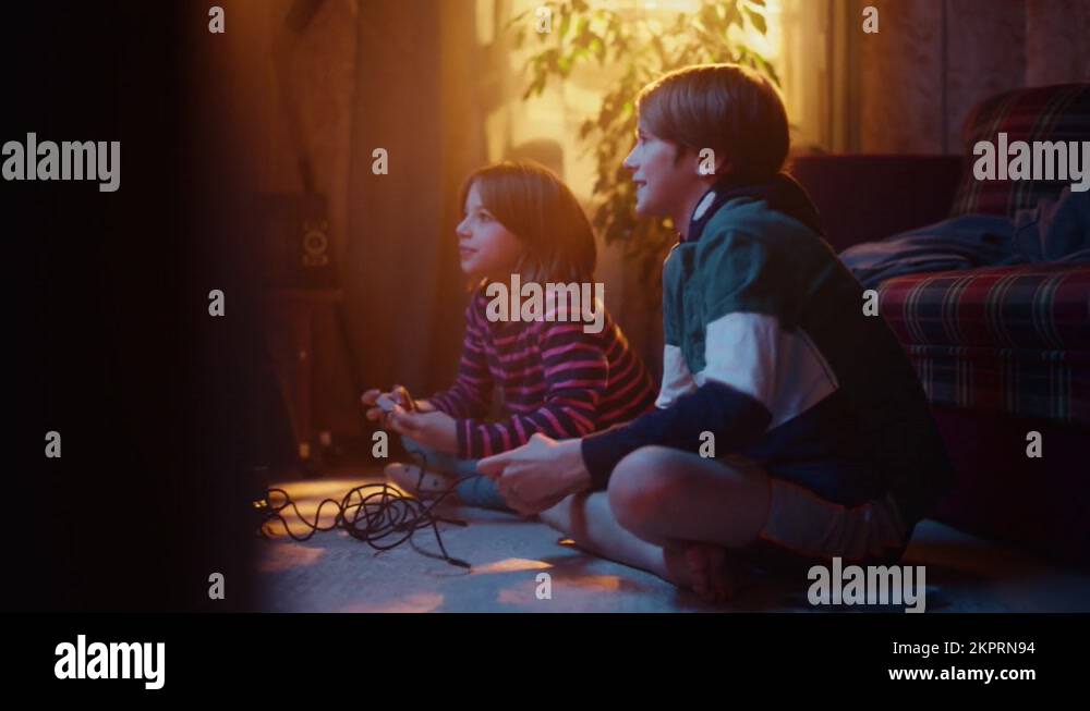 Two Kids Playing Nostalgic Arcade Game at Home Stock Video Footage - Alamy