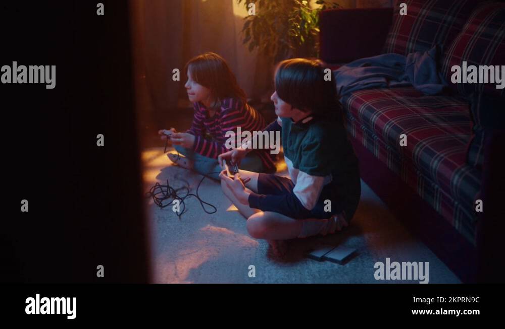 Two Kids Playing Nostalgic Arcade Game at Home Stock Video Footage - Alamy