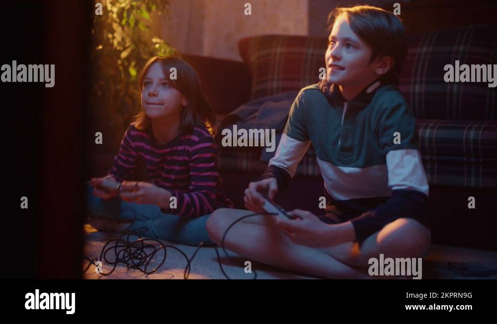 Two Kids Playing Nostalgic Arcade Game at Home Stock Video Footage - Alamy