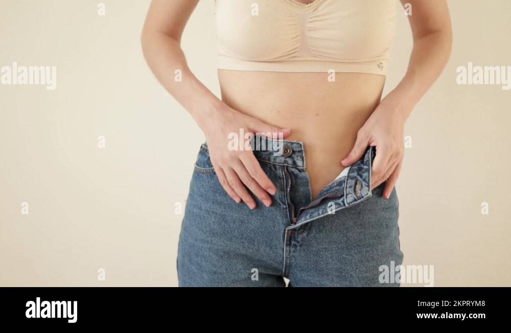 A Young Woman Mother Unbuttons Her Jeans And Shows Her Scar From A Cesarean Stock Video Footage