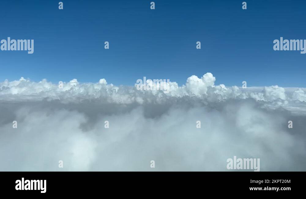 Stunning pilot poin of view from a jet cockpit overflying layers of ...