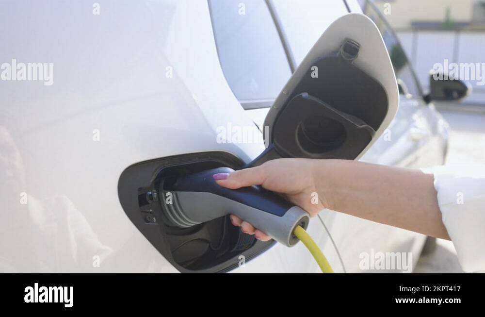 Female hands disconnect and show DC fast charging socket Europe type ...