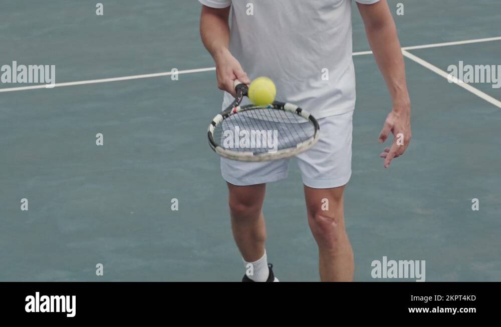 Tennis Player Bouncing Ball on Racket Stock Video Footage - Alamy