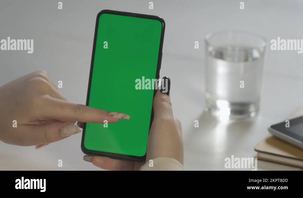 Handheld Camera: Back View of Brunette woman Holding Chroma Key Green ...