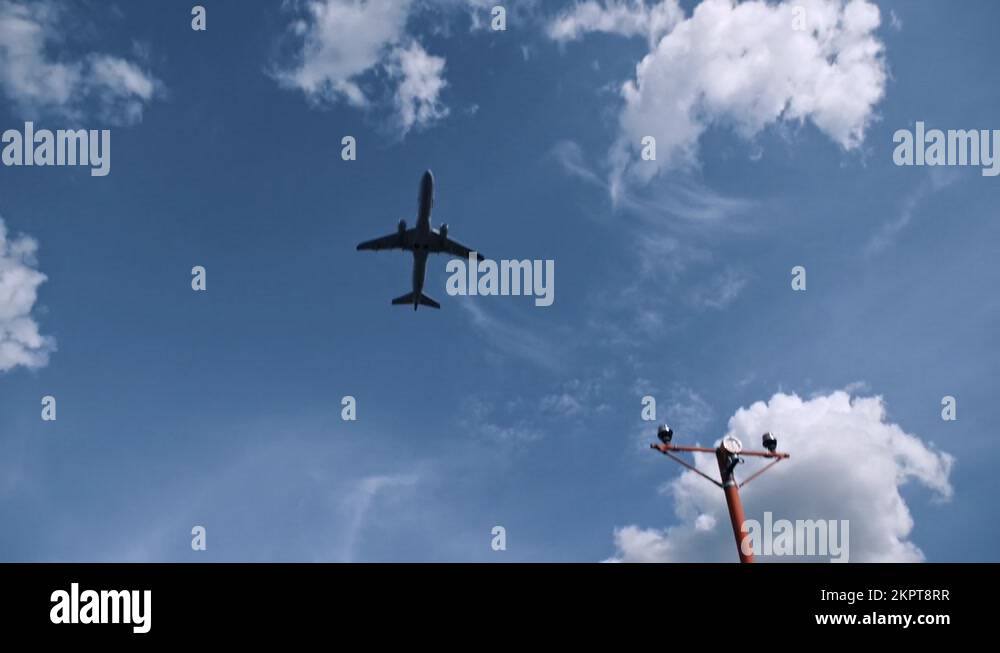 Plane takes off from airport. Front view passenger airplane gaining ...