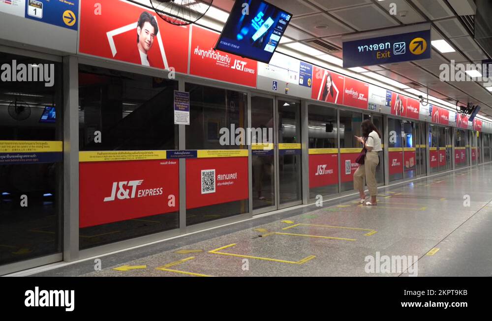 Woman Waiting for A Train at Modern MRT Station in Bangkok, Thailand ...