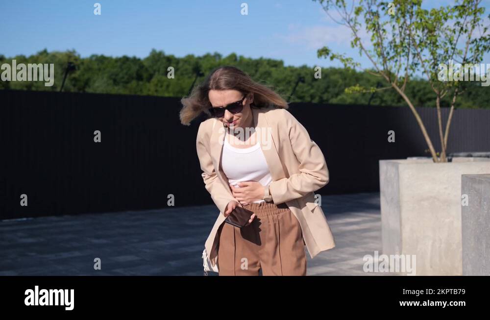 Female office worker suffering from spasm stomach ache belly abdominal ...
