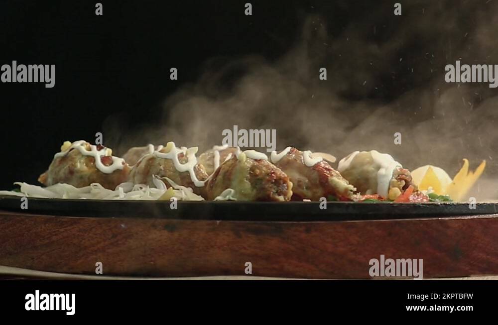 Close-Up Cheese Chicken BBQ Kebab on Round Table with Smoke Black ...