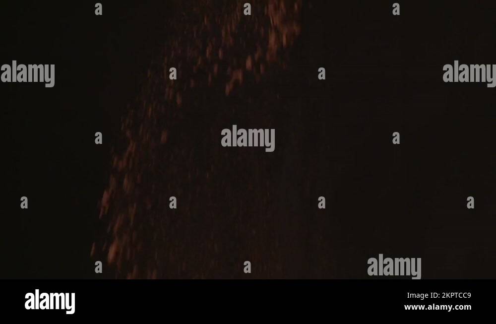 Fine cocoa powder falling in slow motion, creating a spiral. Part of a ...