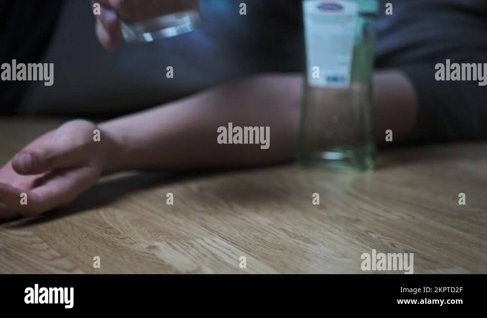 Alcoholic Falls to the Floor with Spilled Glass of alcohol, overdose ...