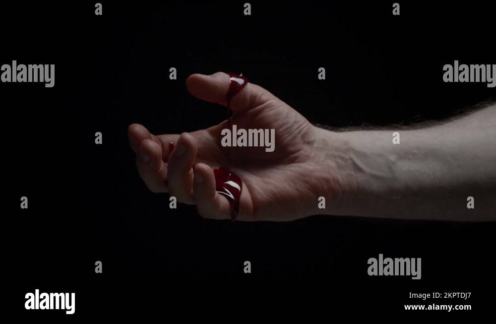 Male hand covered in blood, crime scene, bloody hand on black ...