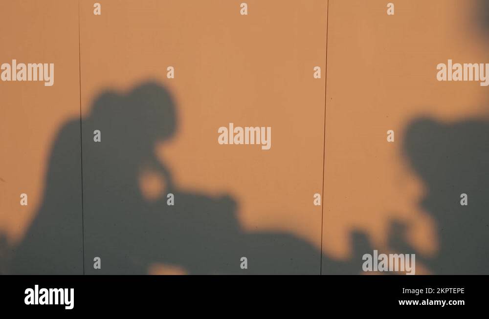 People sitting shadow wall Stock Videos & Footage - HD and 4K Video ...