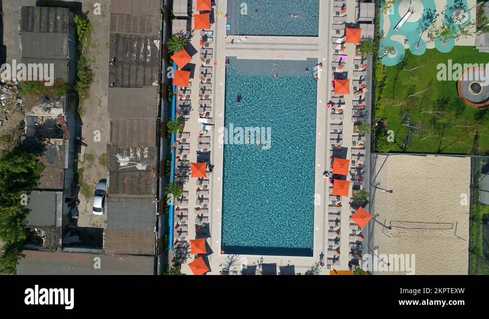 Drone aerial top view people swim in pool on territory Residential ...