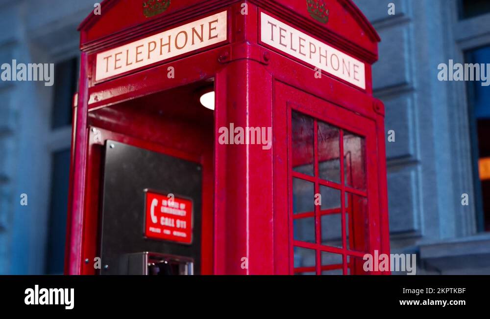 Red British phone booth with a hanging receiver on the wall. London ...