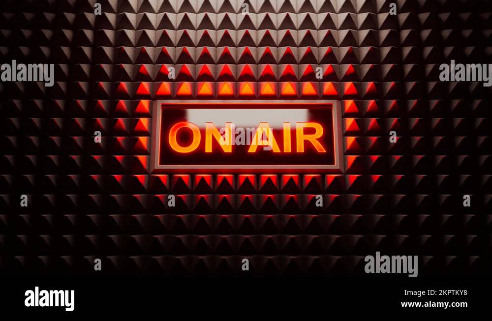 A professional recording studio. An on-air red sign on a soundproofing ...