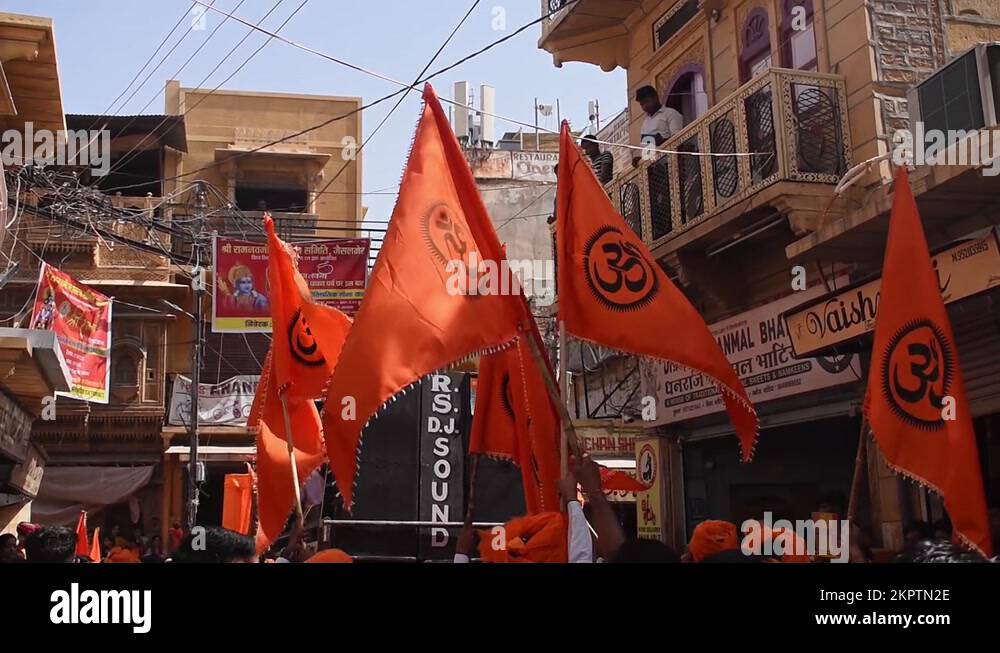Indian Hindu people wave the saffron flag in the parade on the day of ...
