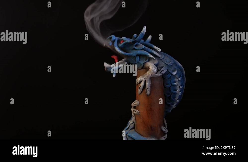 Chinese long dragon statue rotating on a pole in a studio while ...