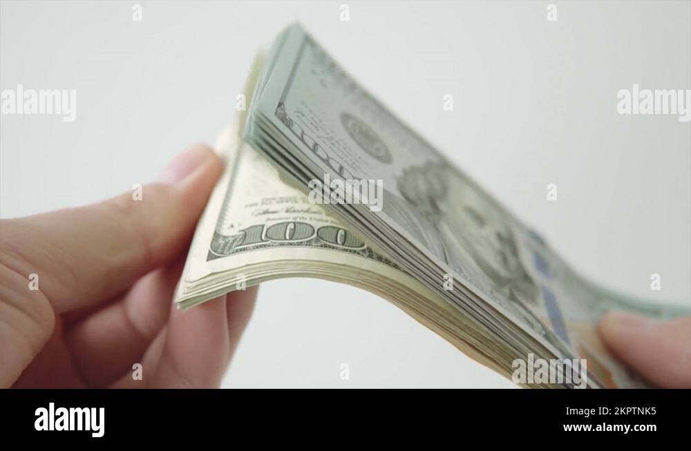 Man counting stack of money in the hands close-up, counting cash bills ...