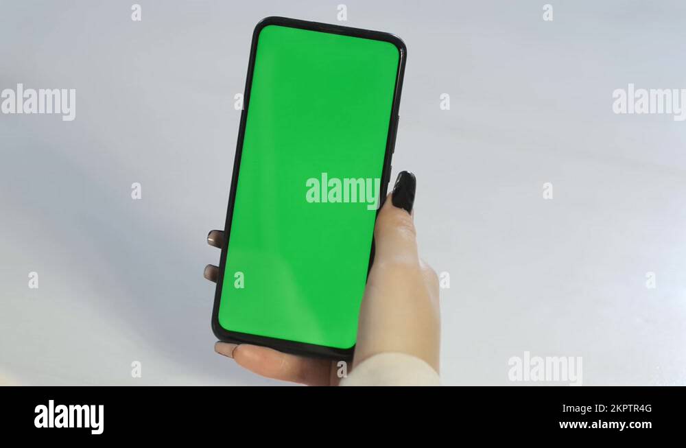 Handheld Camera: Back View of Brunette woman Holding Chroma Key Green ...