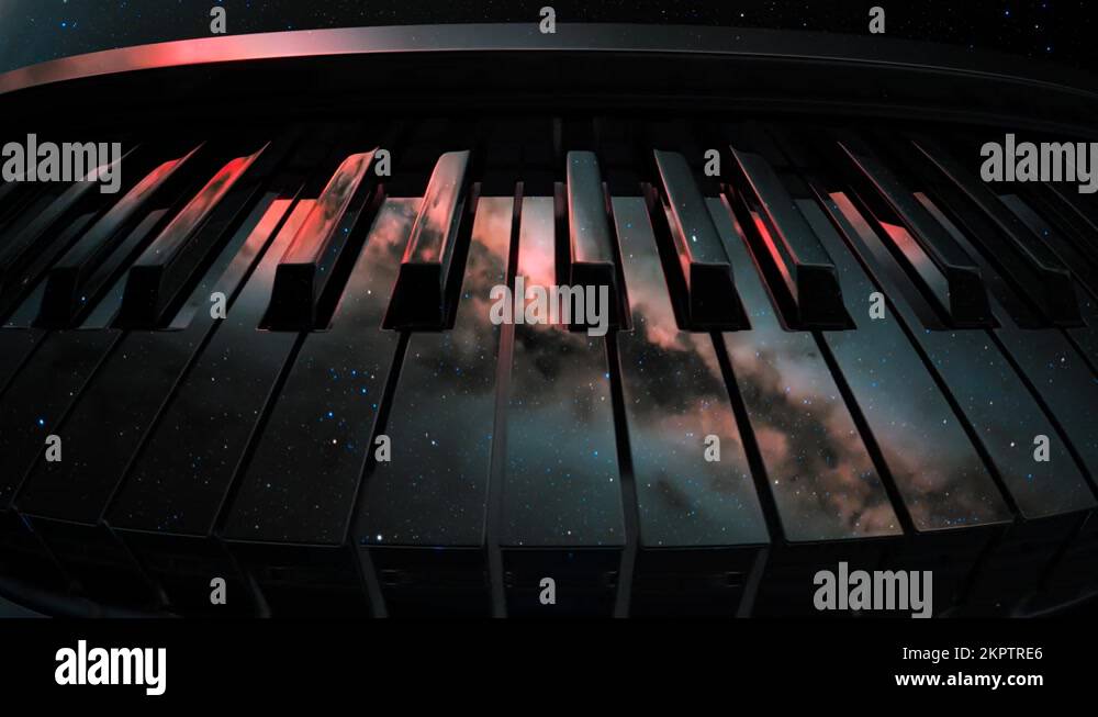 A glossy piano keyboard. Piano keys reflecting the night sky with the ...