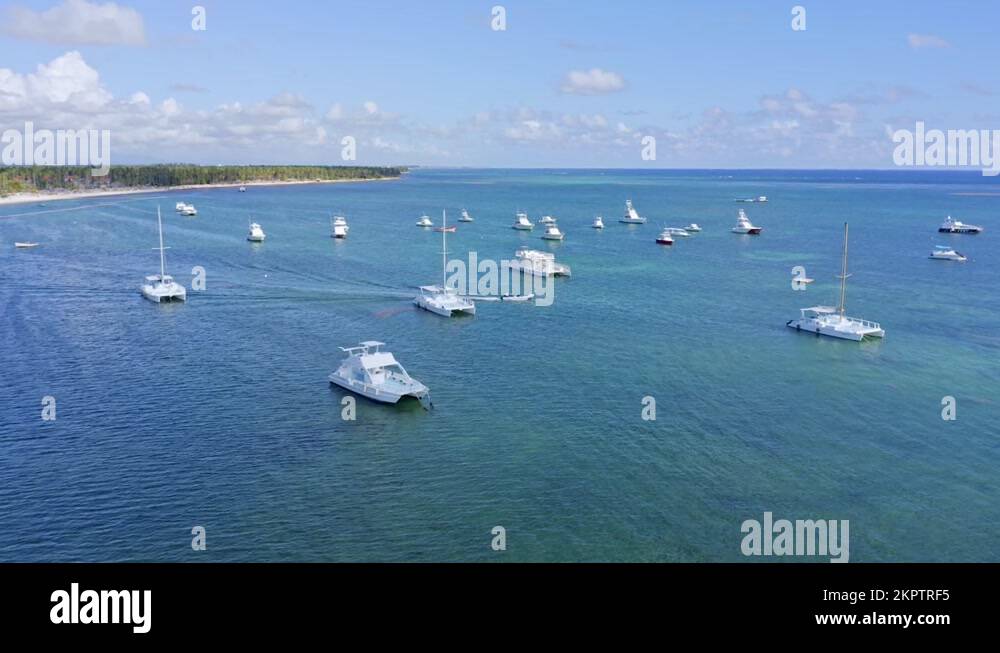 Leisure boats anchored on azure Caribbean coastline, Playa Bavaro ...