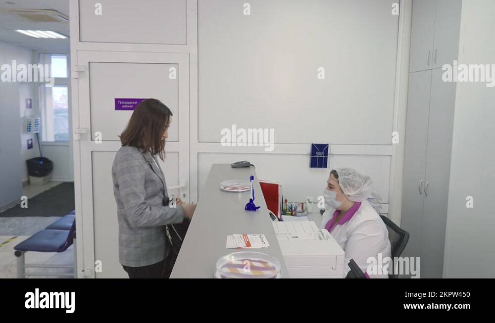 Patient Arrives At Hospital Reception For Doctor Consultation ...