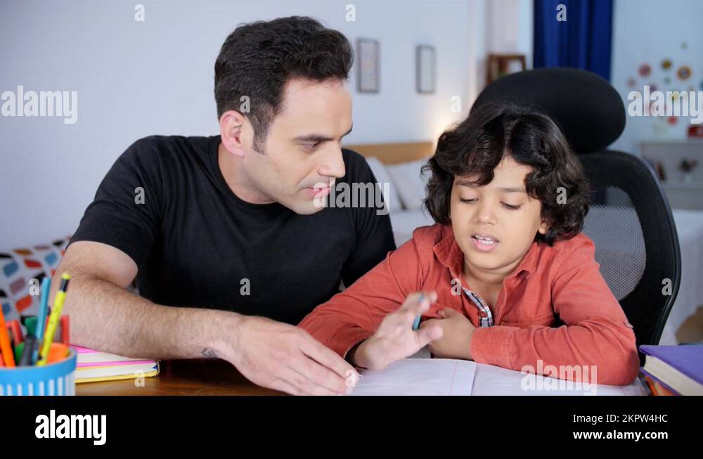 A happy father-son duo - Indian single father teaching his son, nuclear ...