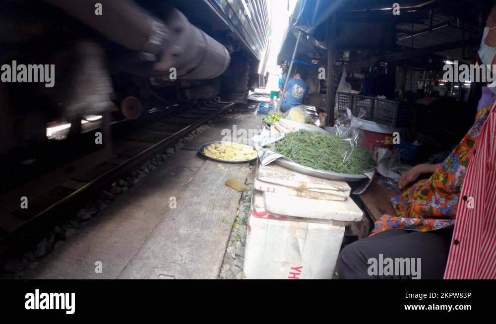 Train track pass through fresh market Stock Video Footage - Alamy