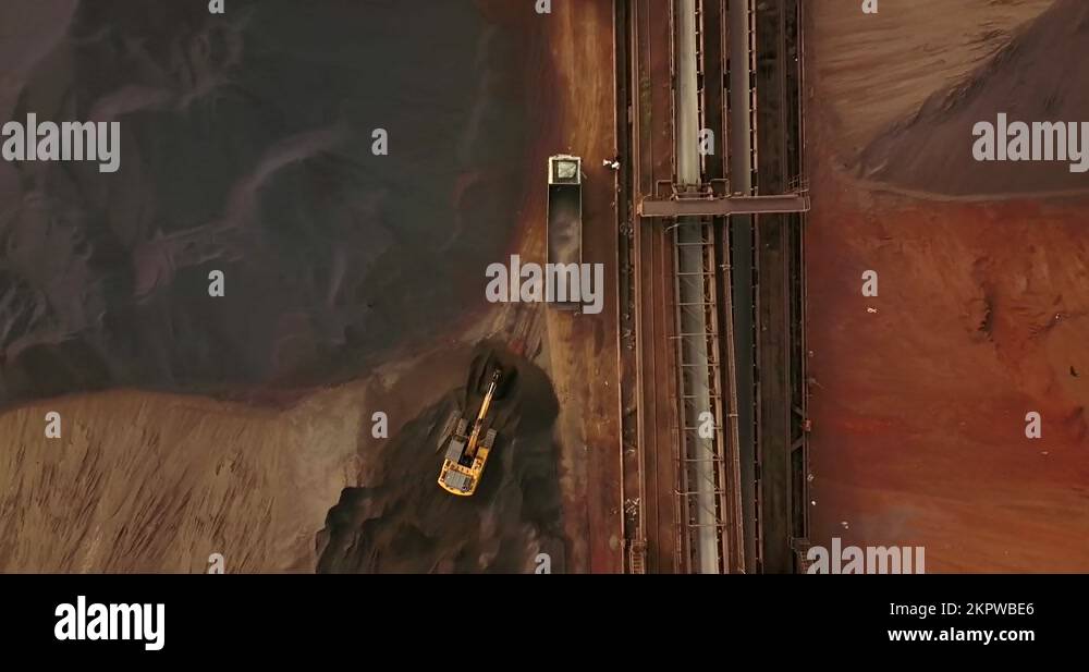 Excavator Loading Dump Trucks With Coal At Industrial Port In Paradip ...