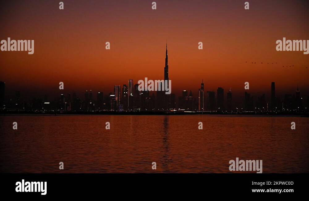Lockdown Flock Of Birds Flying By Burj Khalifa In City By Sea During ...