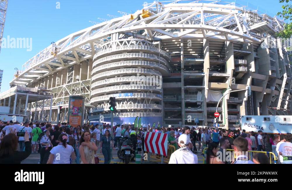 Real Madrid fans arrive at the Santiago Bernabeu stadium to watch live ...