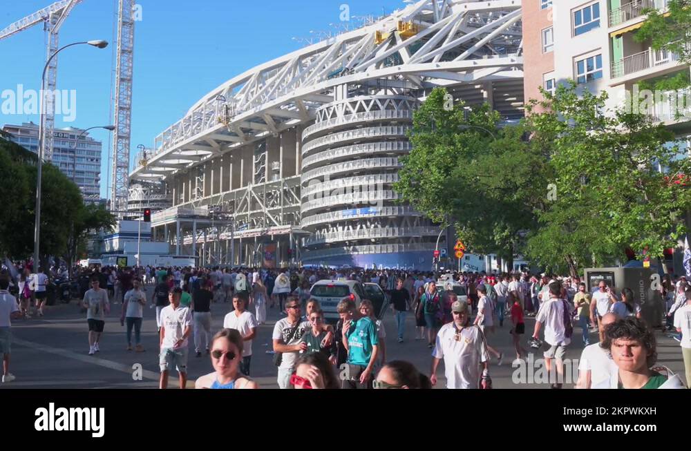 Real Madrid fans arrive at the Santiago Bernabeu stadium to watch live ...