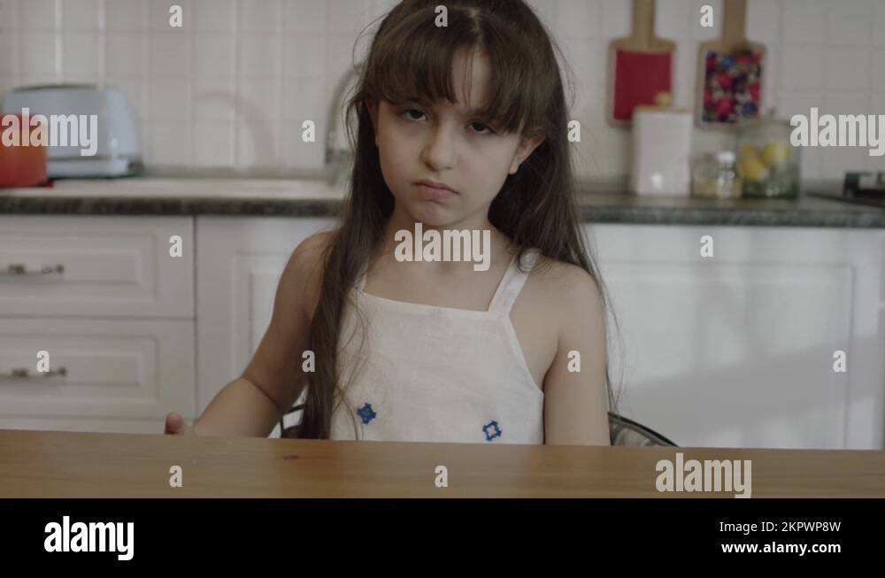 Little girl angry, angry and disobedient to bad behavior showing middle ...