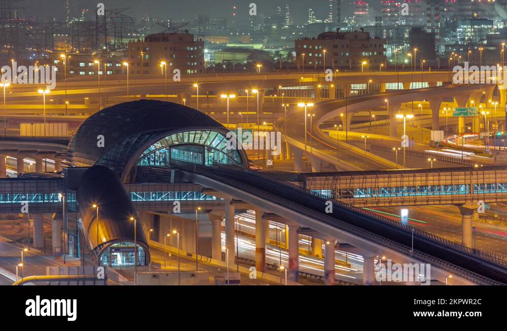 Futuristic building of Dubai metro station and big junction behind in ...